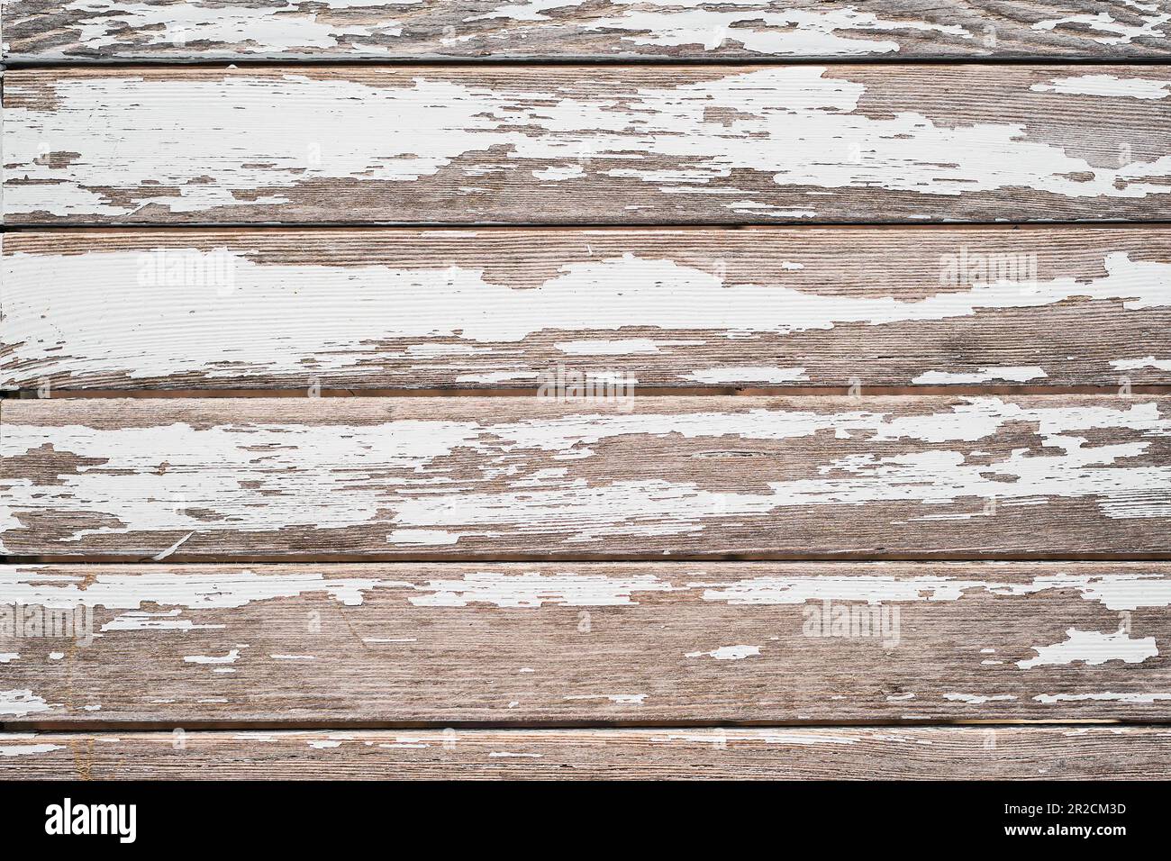 Wooden background, old painted boards, with old peeling white paint ...