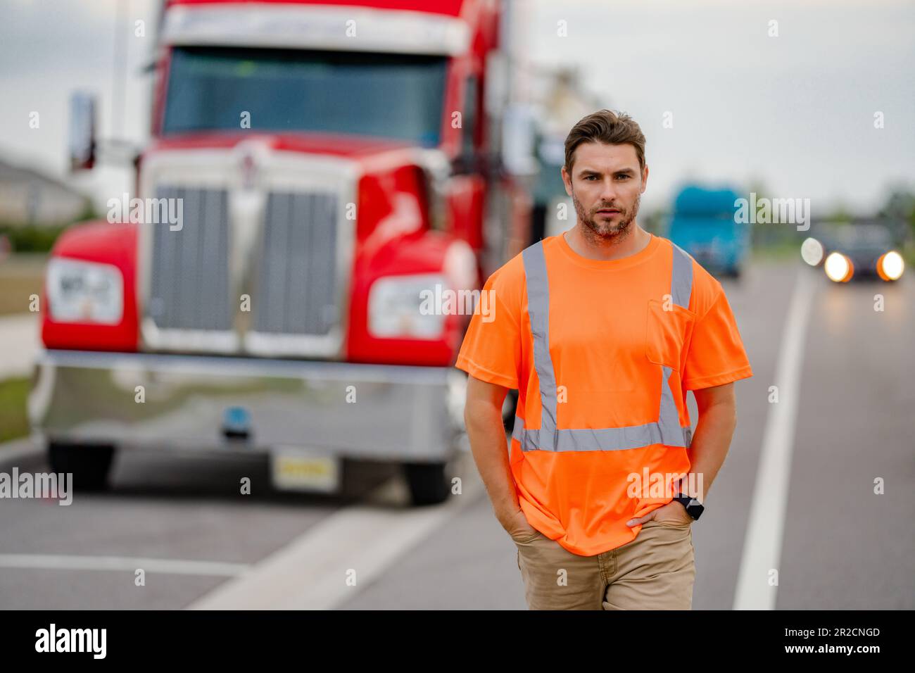 Men driver near lorry truck. Man owner truck driver in safety vest near ...