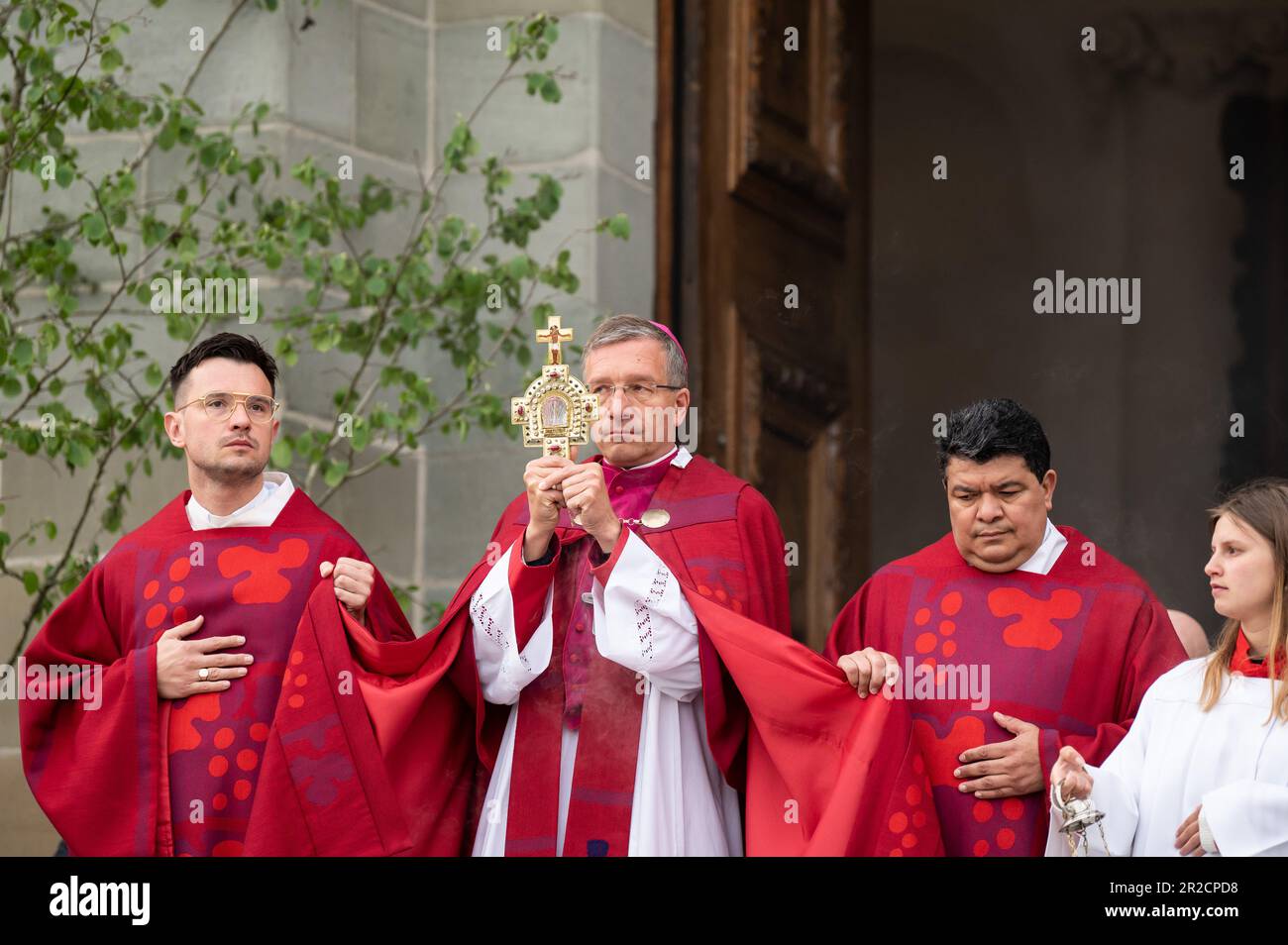 Weingarten, Germany. 19th May, 2023. Bishop Michael Gerber (M) holds ...