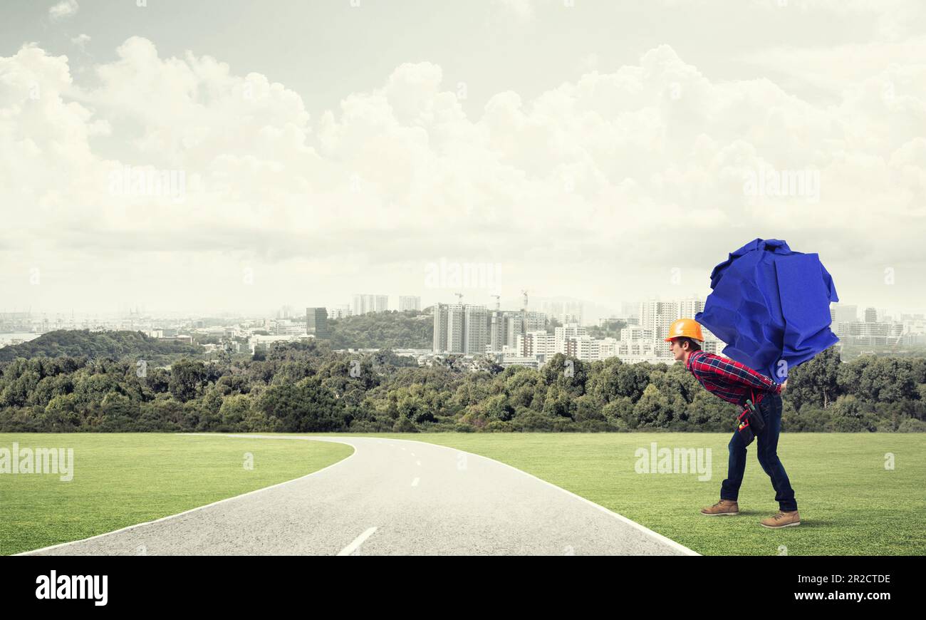 Engineer man carry load Stock Photo - Alamy