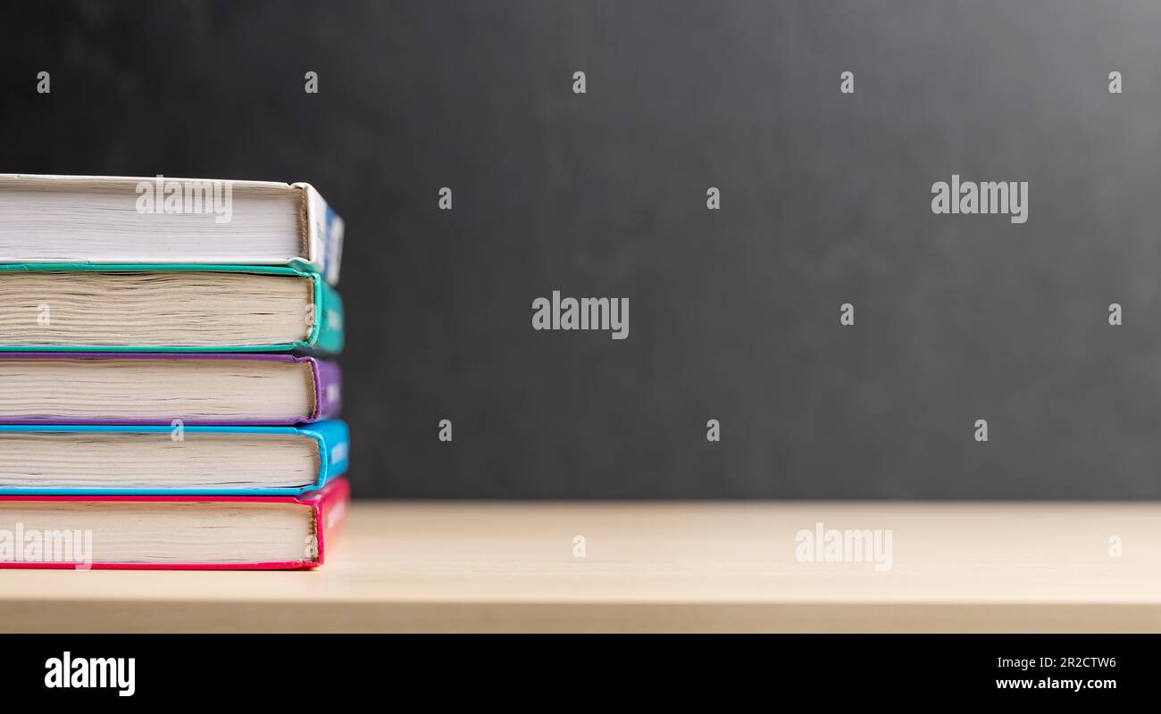Stack of books on desk with chalkboard and space for creativity Stock ...