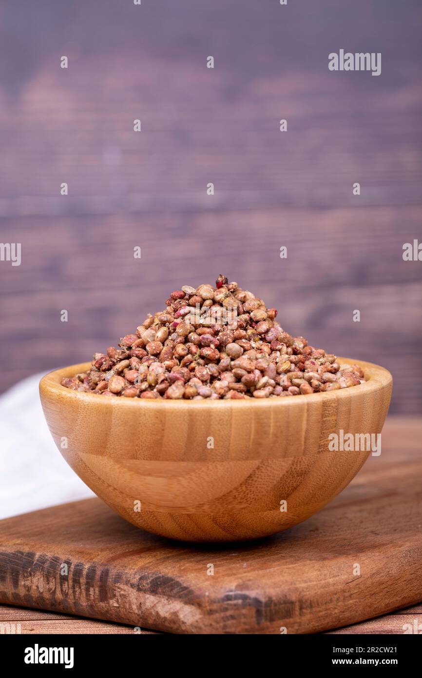 Sumac seeds. Dried sumac berries on wooden background. Spice concept ...