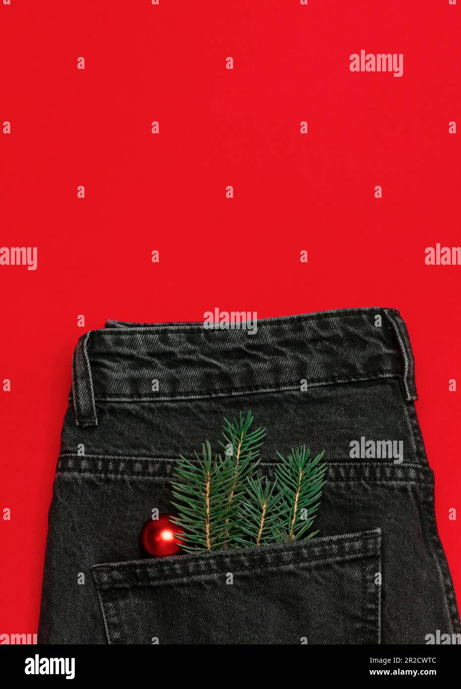 Christmas, New year jeans, denim trousers on red background for store ...