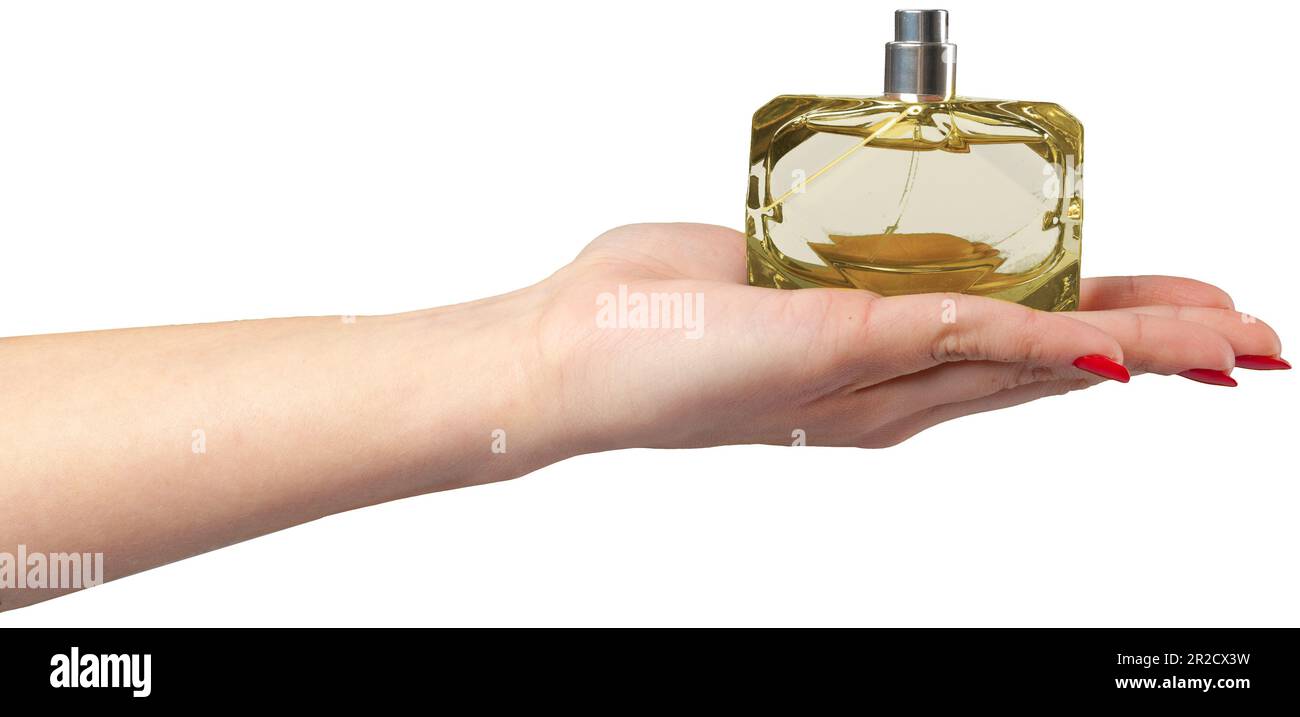 woman hand holding perfume bottle Stock Photo - Alamy