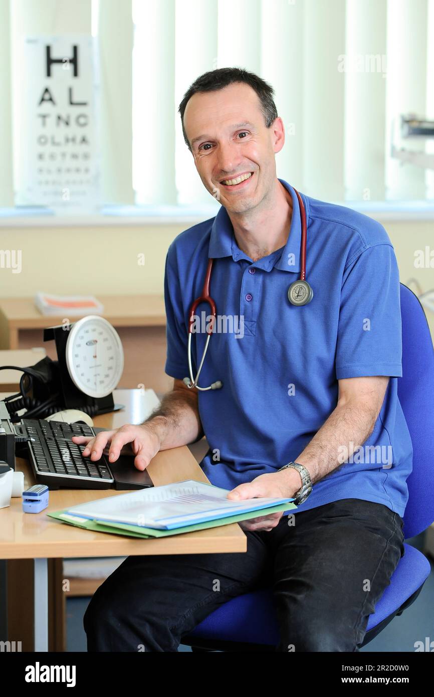 A NHS GP Doctor pictured in his general surgery. North Devon England UK Stock Photo - Alamy