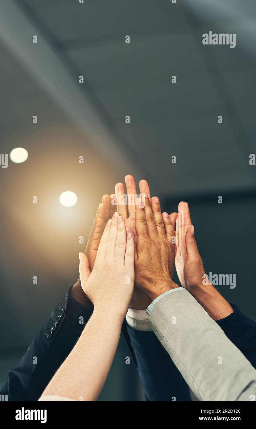 High five, teamwork and hands of business people in office for celebration, team building and ...