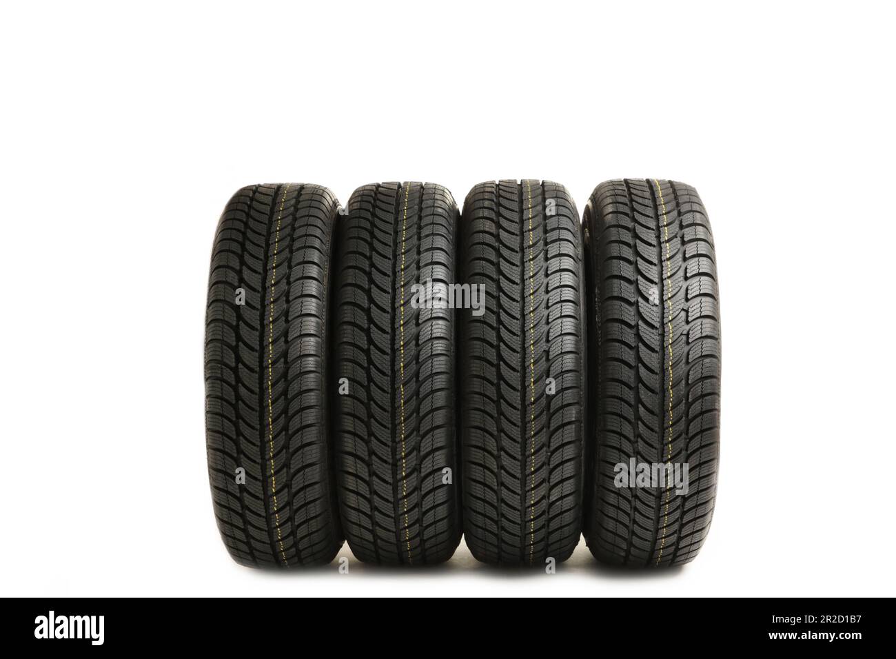 Four new black tires isolated on white background. Top view Stock Photo ...