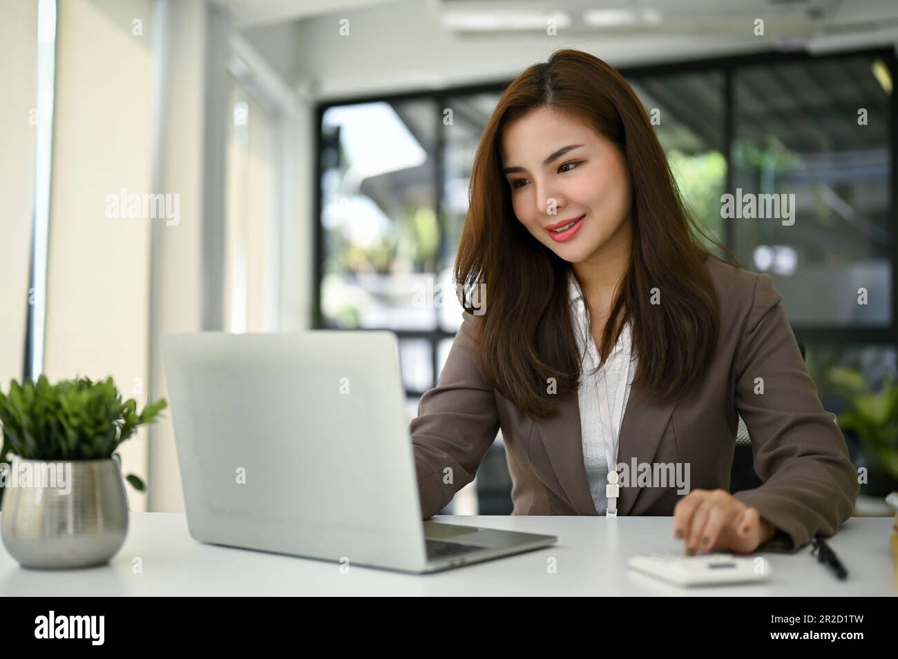 Concentrated asian female accountant hi-res stock photography and ...
