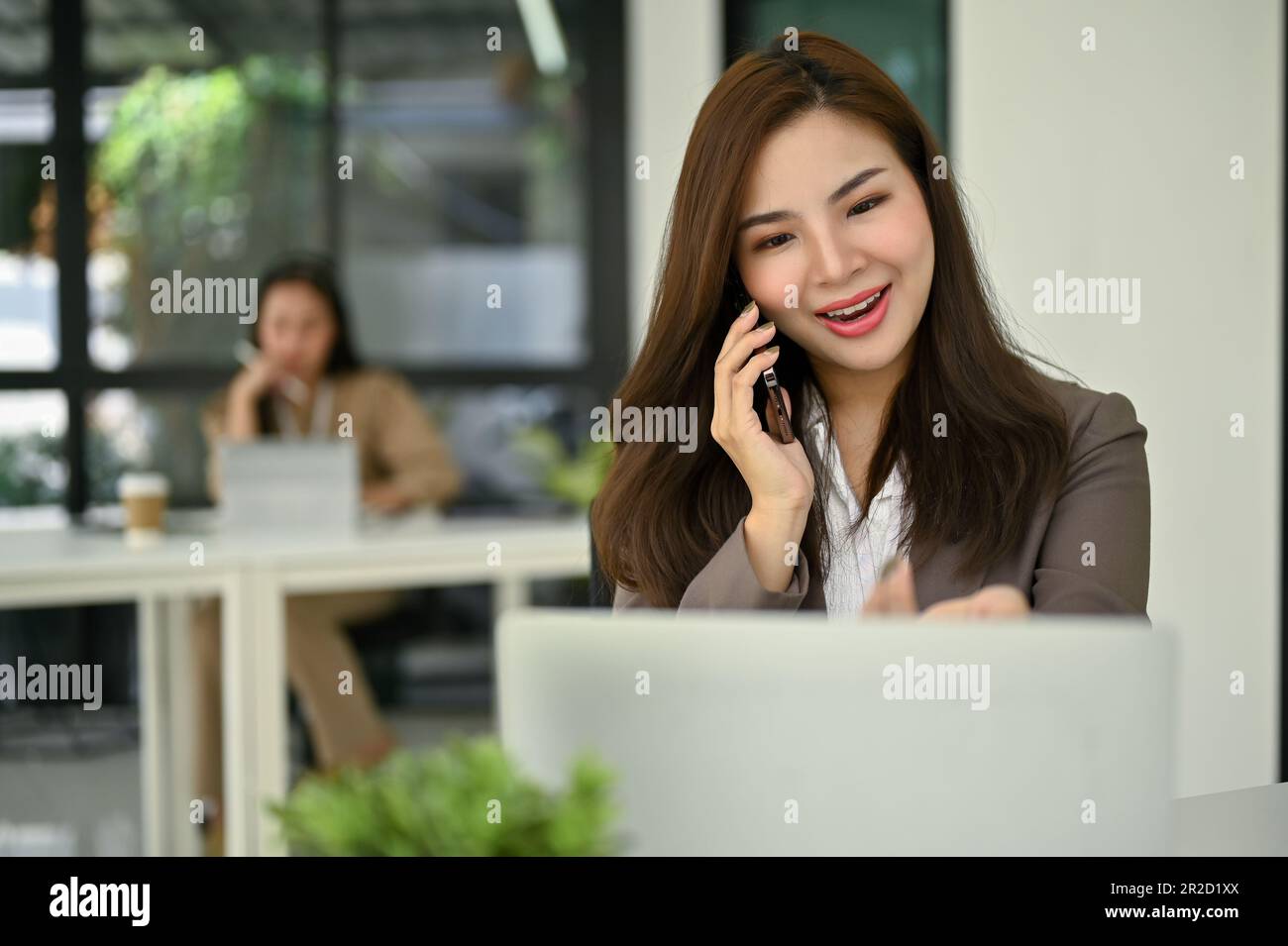 Asian female agent giving insurance hi-res stock photography and images ...