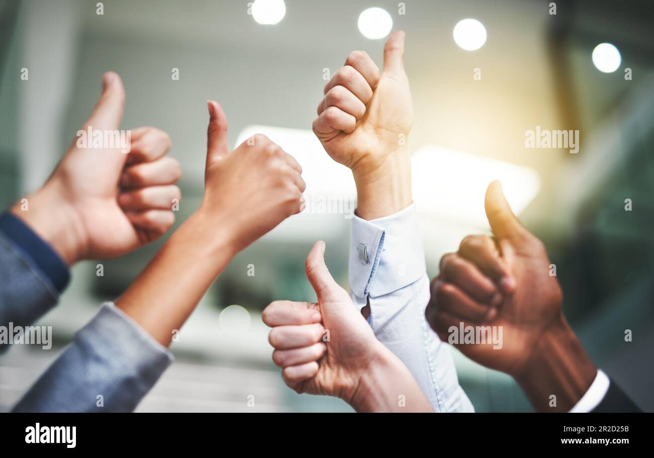 Thumbs up, success and winner with hands of business people in office ...
