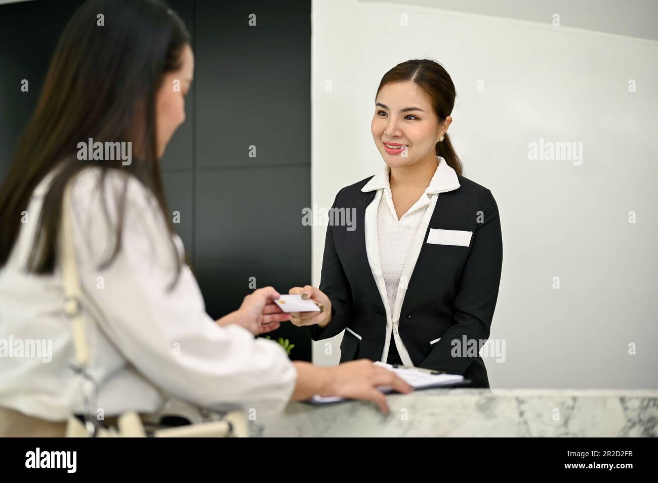 Handing out business card hi-res stock photography and images - Alamy