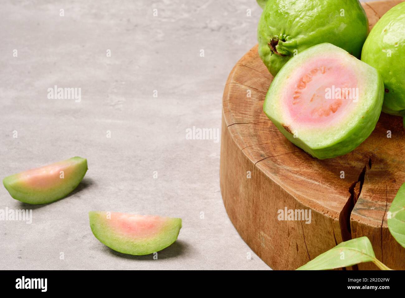 Pink guava fruits isolated on concrete background.Guava fruit with leaf ...