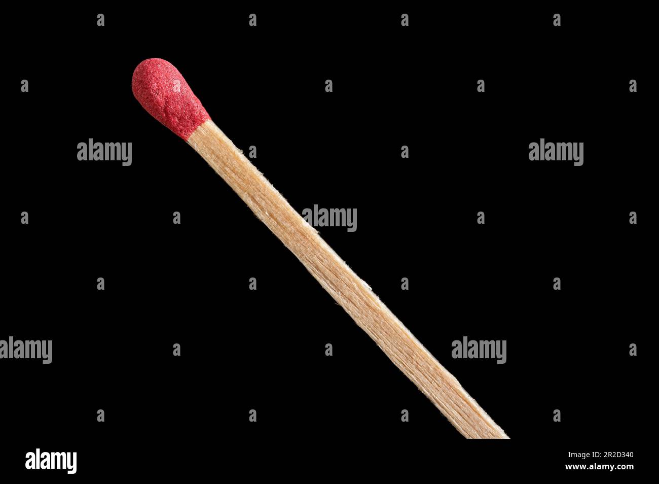 Matchstick with its red match and its wooden stick in extreme close-up ...