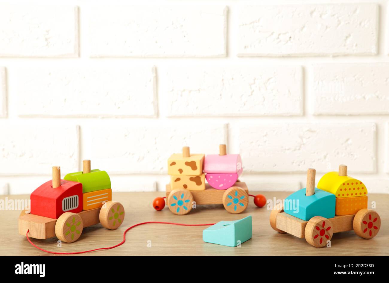 Stacking train toddler toy for little children on light background with ...