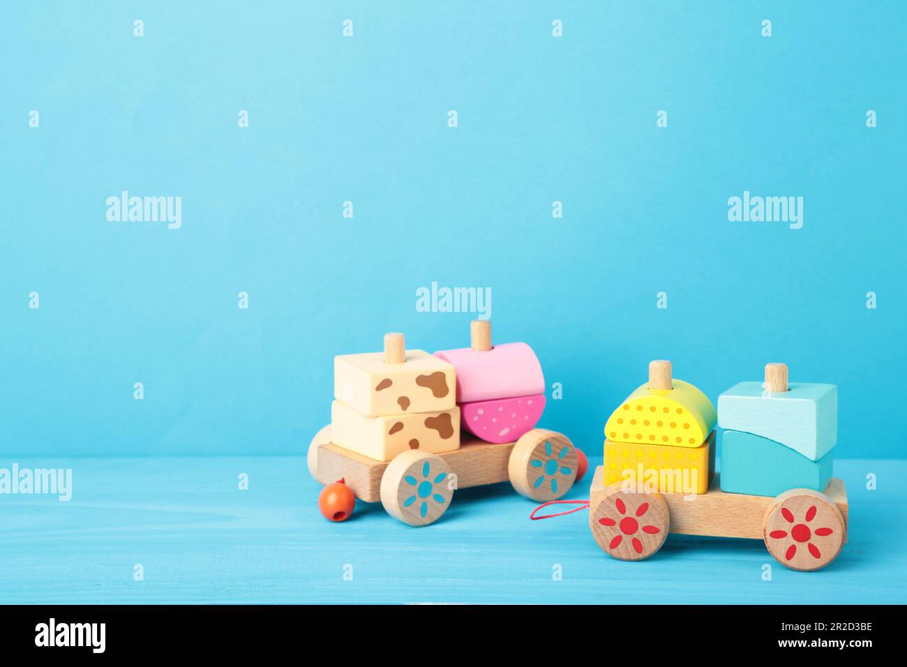Stacking train toddler toy for little children on blue background with ...