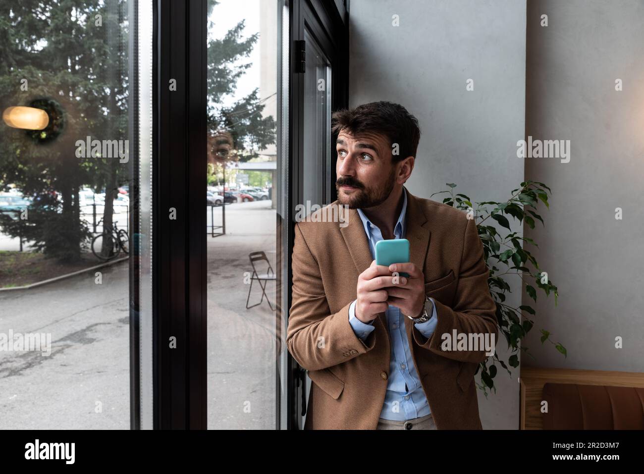 Concentrated busy business person in formal suit using cellphone ...