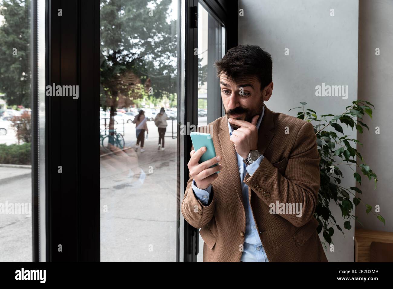 Concentrated busy business person in formal suit using cellphone ...