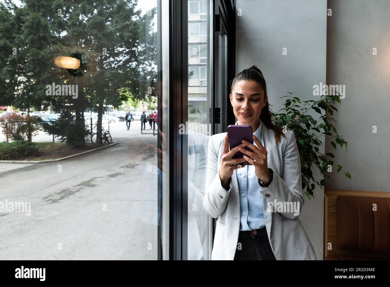 Concentrated busy business person in formal suit using cellphone ...