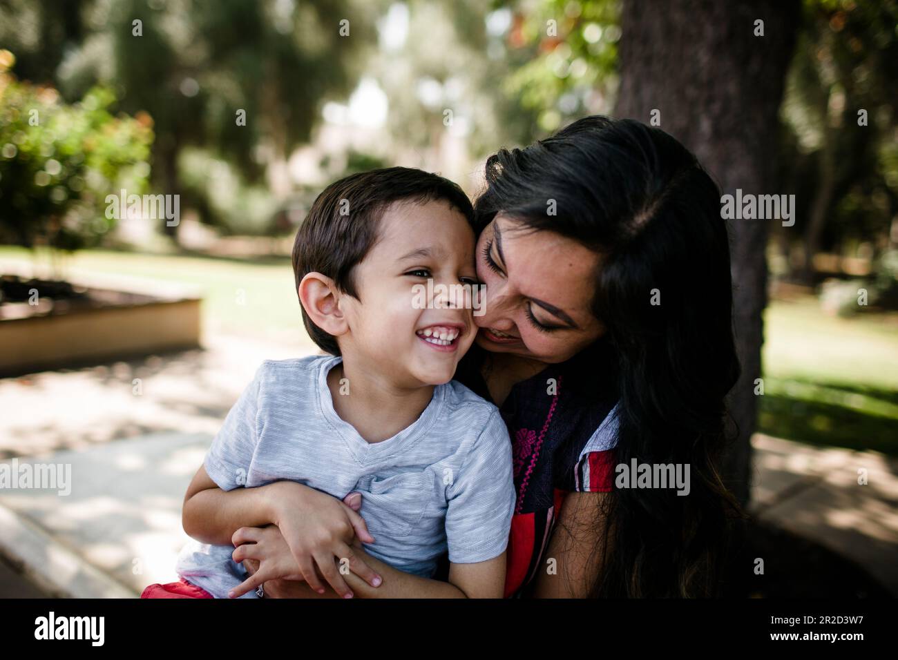 Mother & Autistic Son Laughing & Hugging Stock Photo - Alamy