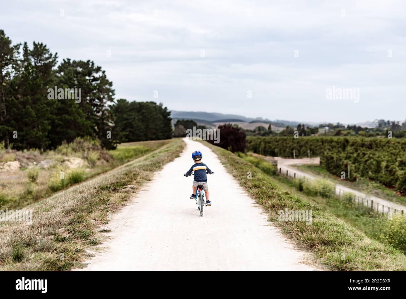Young boy riding a bike on remote path in New Zealand Stock Photo - Alamy