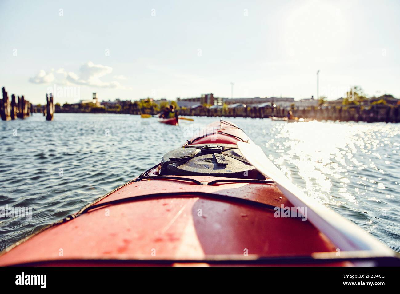 Red sea kayak at sunset floating in Casco Bay, Maine Stock Photo - Alamy