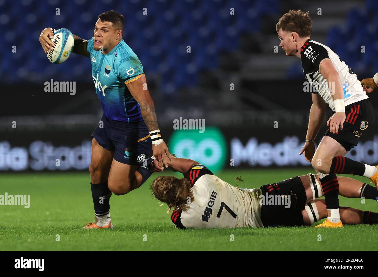 Levi Aumua of Moana Pasifika and Corey Kellow of The Crusaders during ...