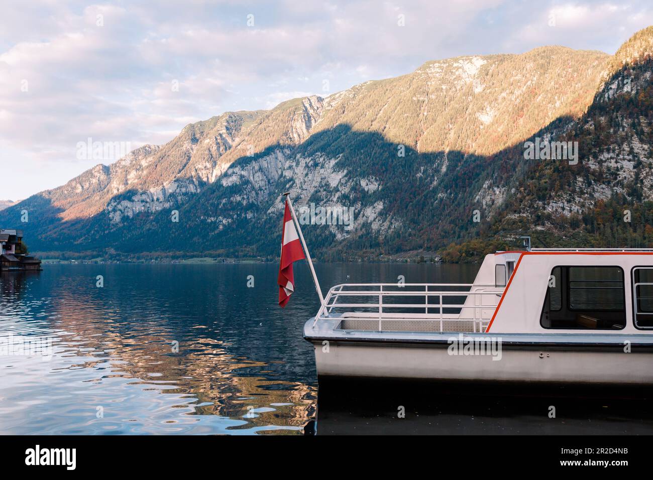 boat with an Austrian flag near the shores of Lake Hallstatt Stock ...