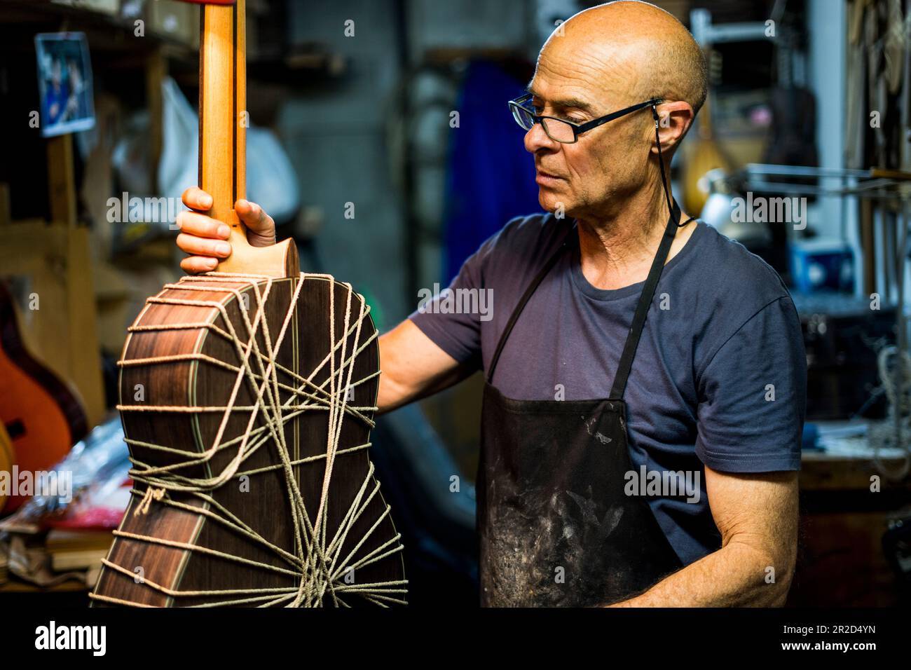 Luthier man making guitars in artisan workshop in Spain Stock Photo - Alamy