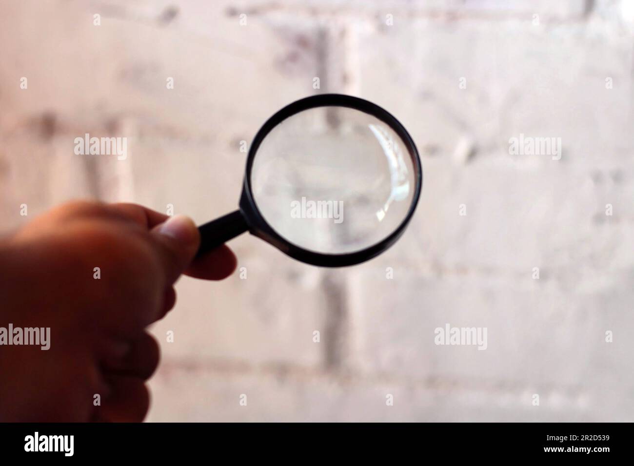 Doctor taking a magnifying glass Stock Photo - Alamy