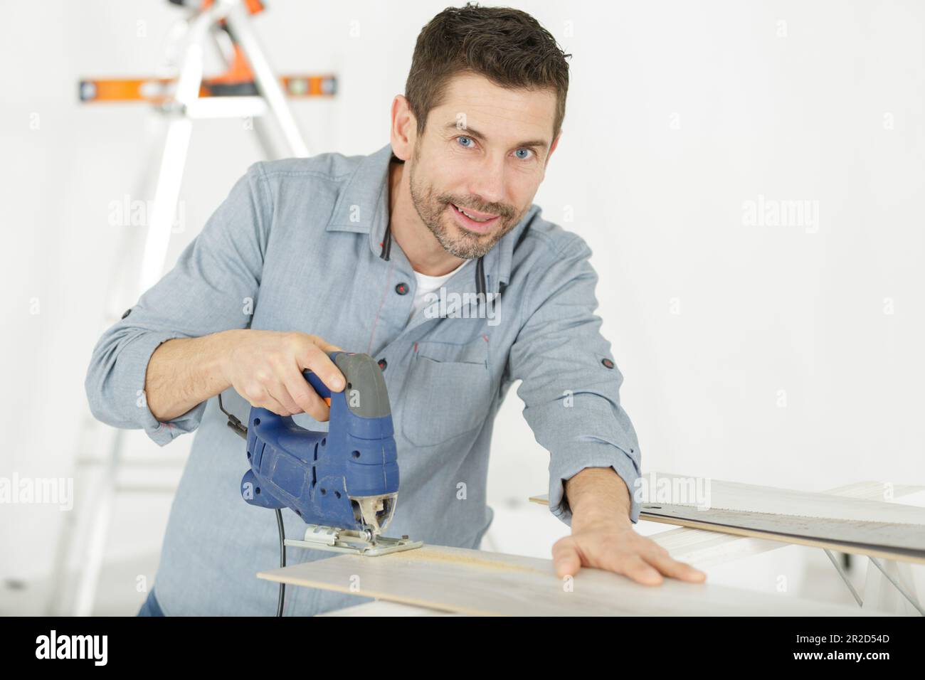 Man cuts board manual electric hi-res stock photography and images - Alamy