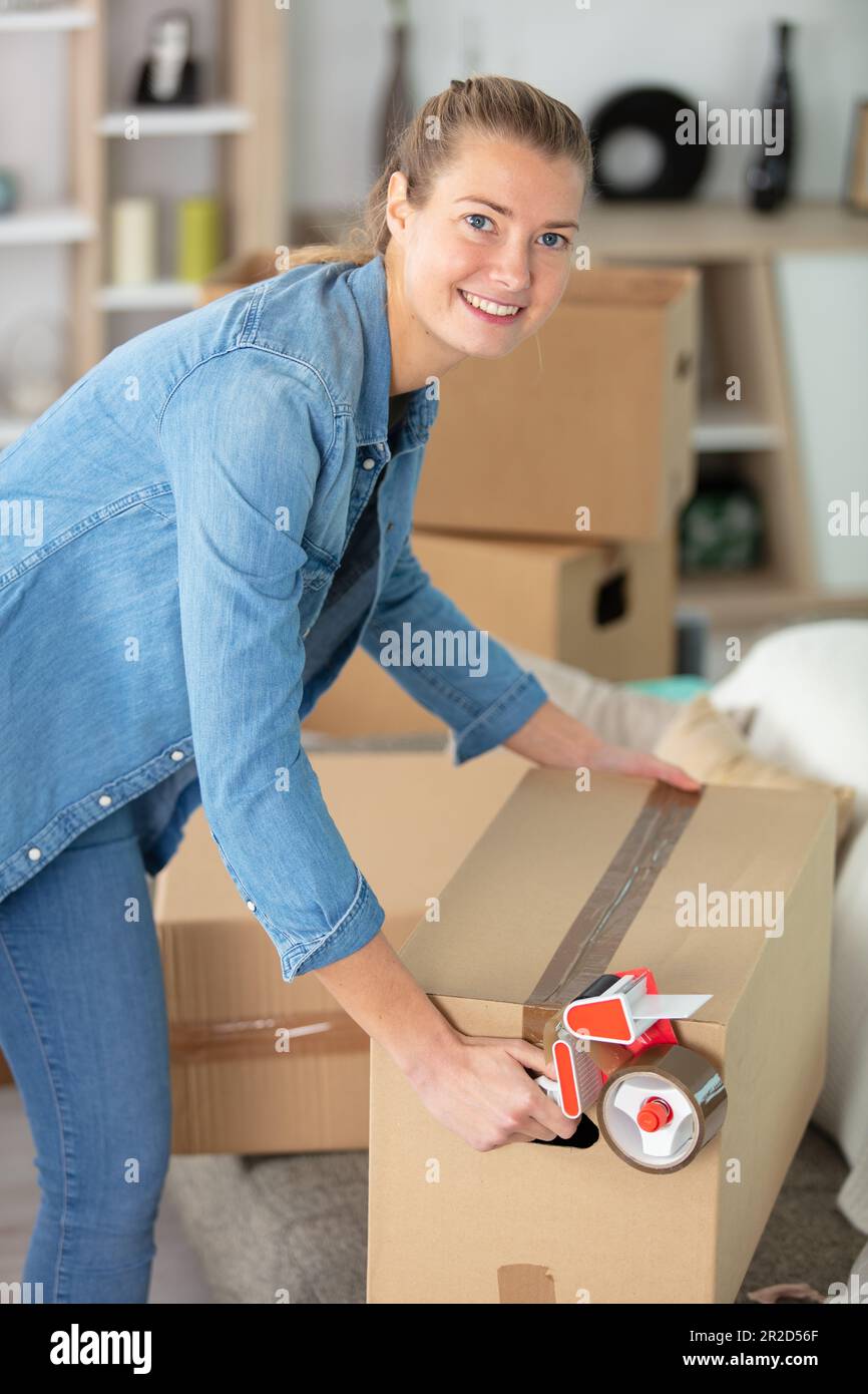 woman packing boxes for moving home Stock Photo - Alamy