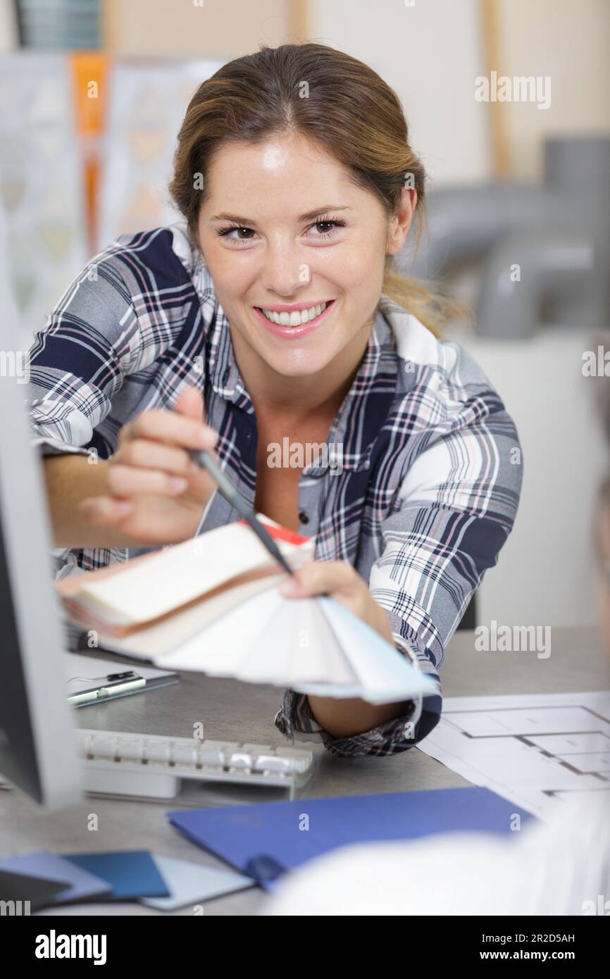 woman designer asking customer to choose color from color palettes ...