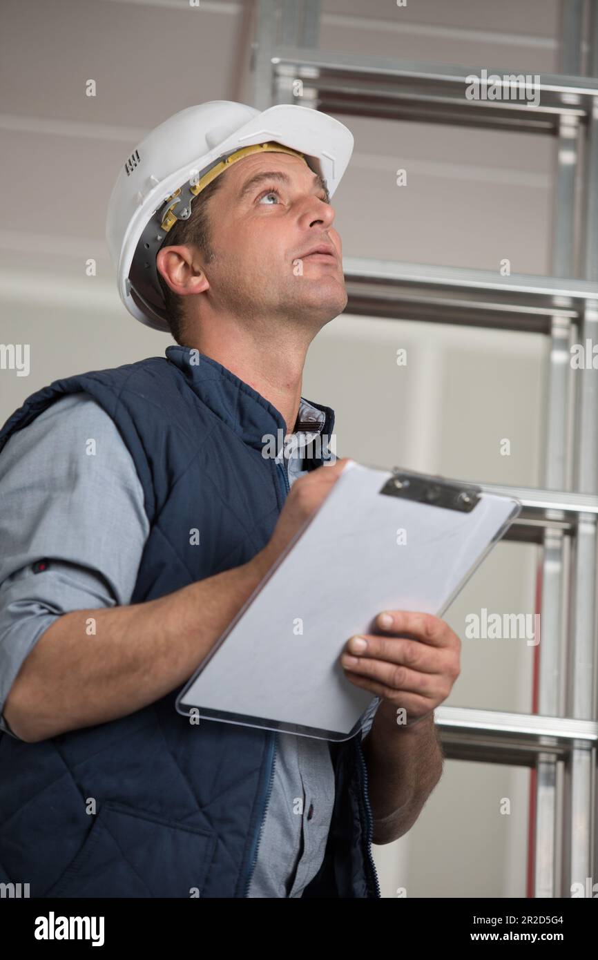 construction expert checking a new construction Stock Photo - Alamy