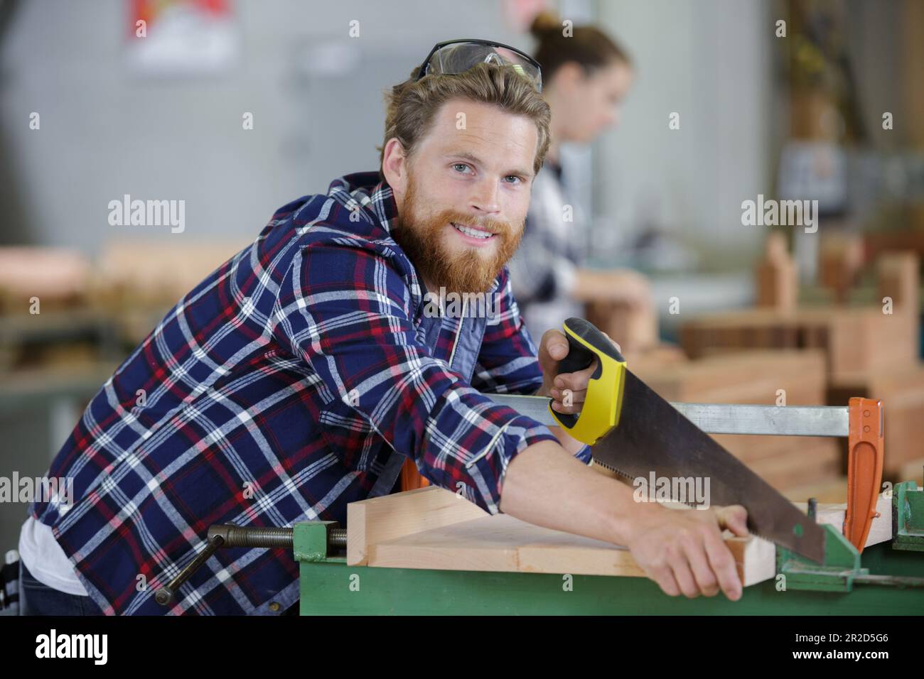 skilled craftsman cutting a wooden plank Stock Photo - Alamy