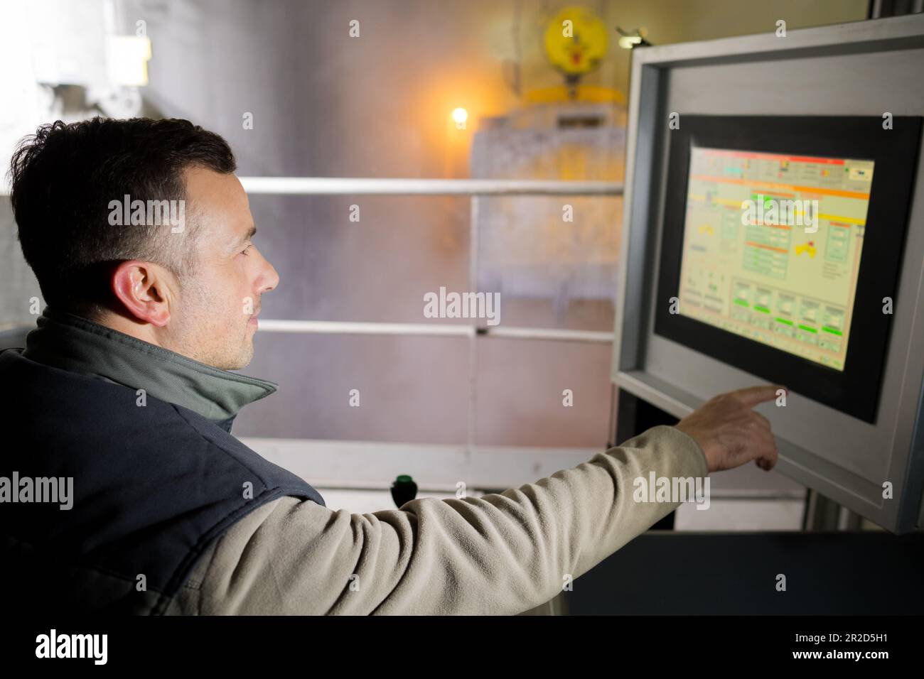 engineer operating machinery on computer touchscreen monitor Stock ...
