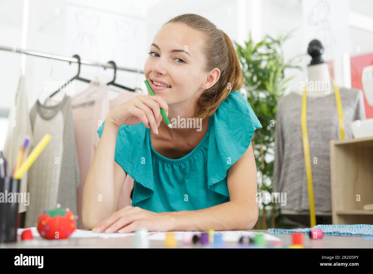 Young woman seamstress posing hi-res stock photography and images - Alamy