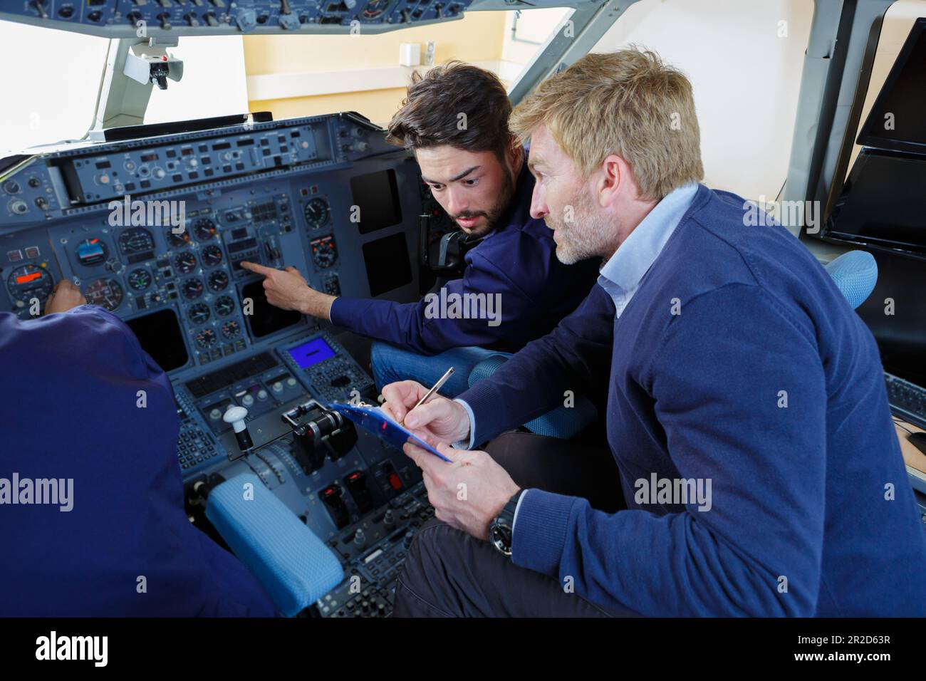 2 man on helicopter cockpit Stock Photo - Alamy