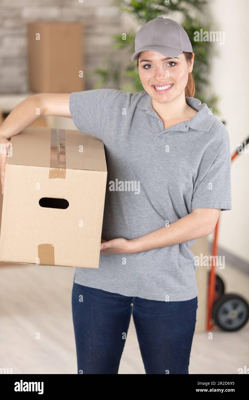 Woman open door delivery man hi-res stock photography and images - Alamy