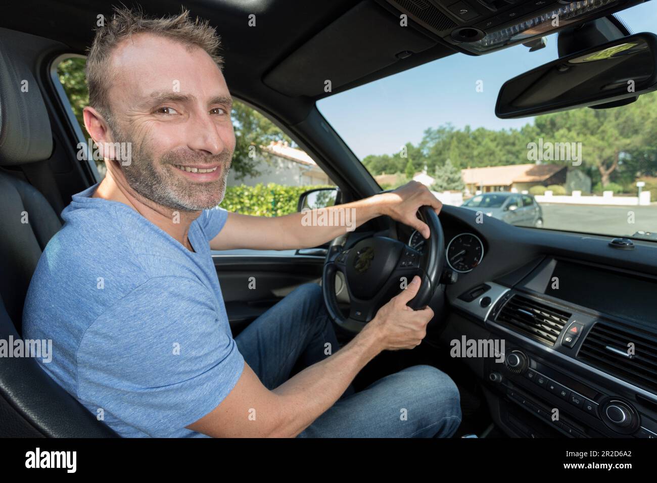 happy man in car smiling Stock Photo - Alamy