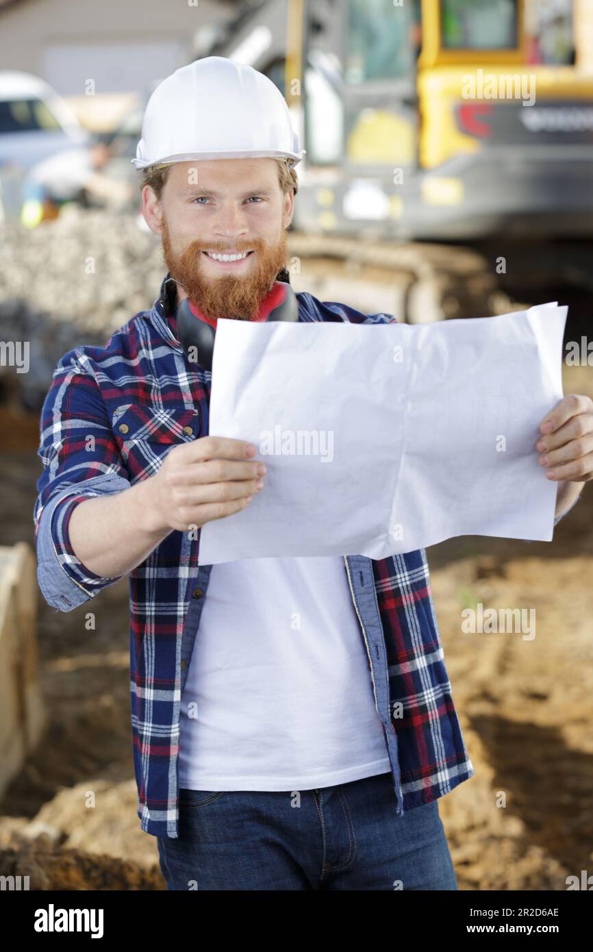 civil engineer is examining blueprint Stock Photo - Alamy