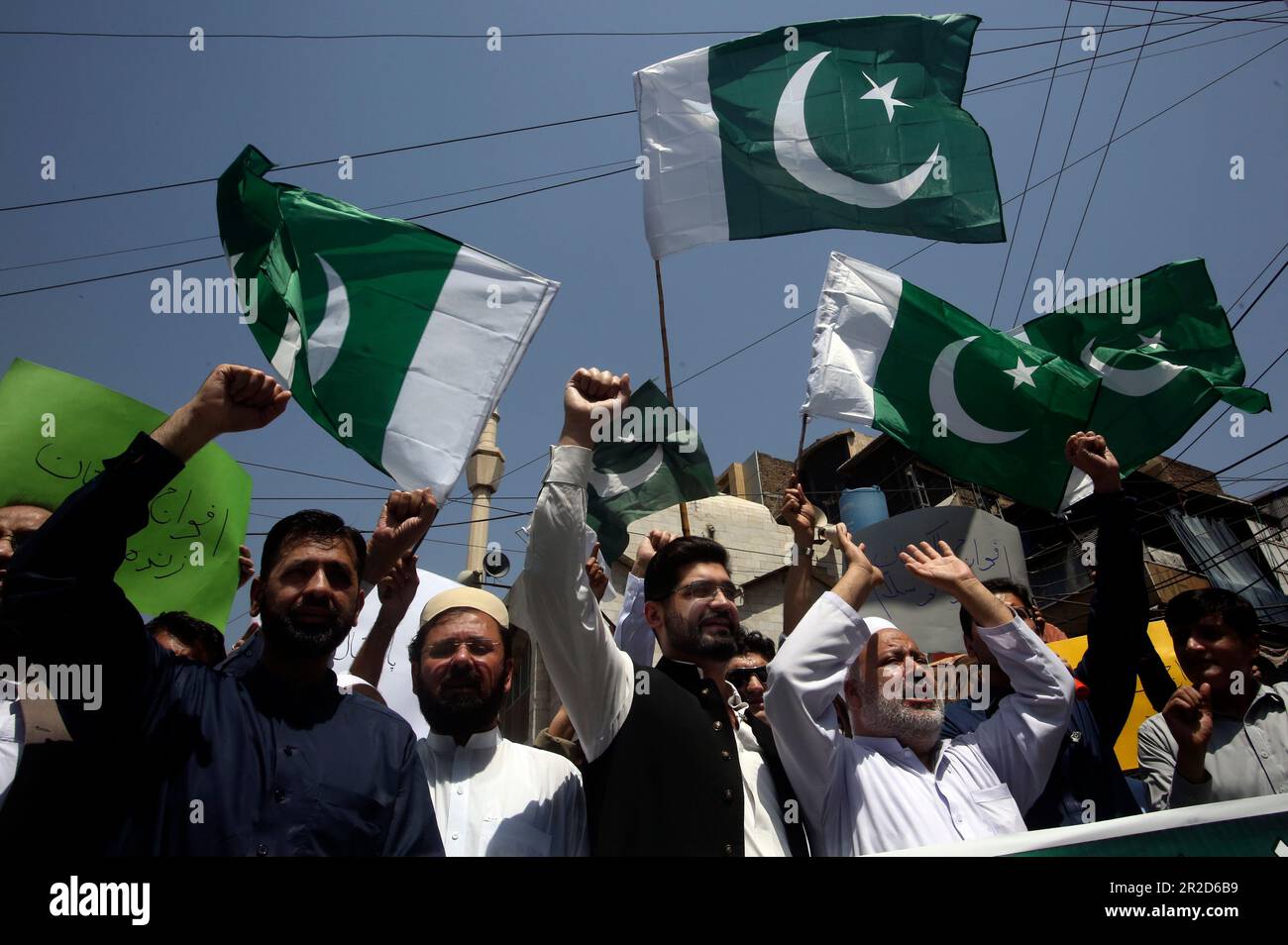 People take part in a rally to show solidarity with Pakistan's army in ...