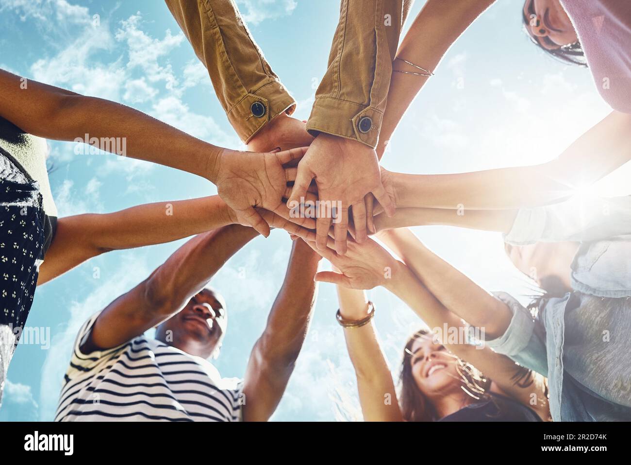 Team building, hands and low angle of business people in solidarity or ...