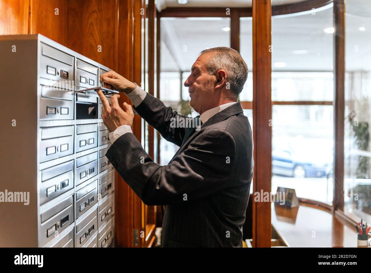 concierge opening the mailboxes of the residents of the building Stock ...