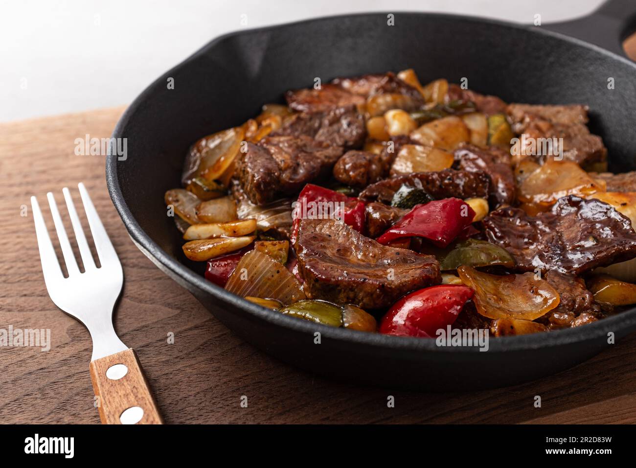 Steak Bites with small pieces of beef and vegetables stir-fried in ...