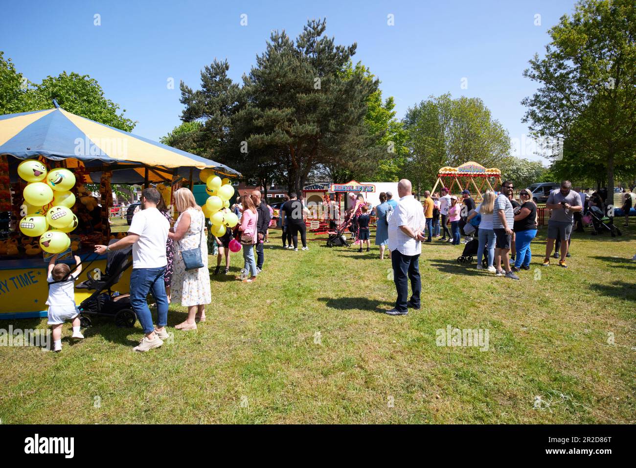 stalls and fairground games at a local community summer fair simonswood ...