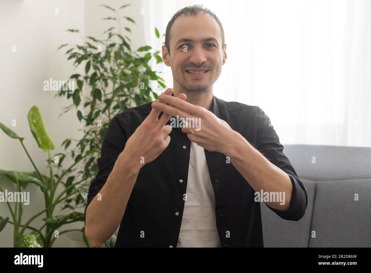 Adult Learning Sign Language For Deaf Disabled Stock Photo - Alamy