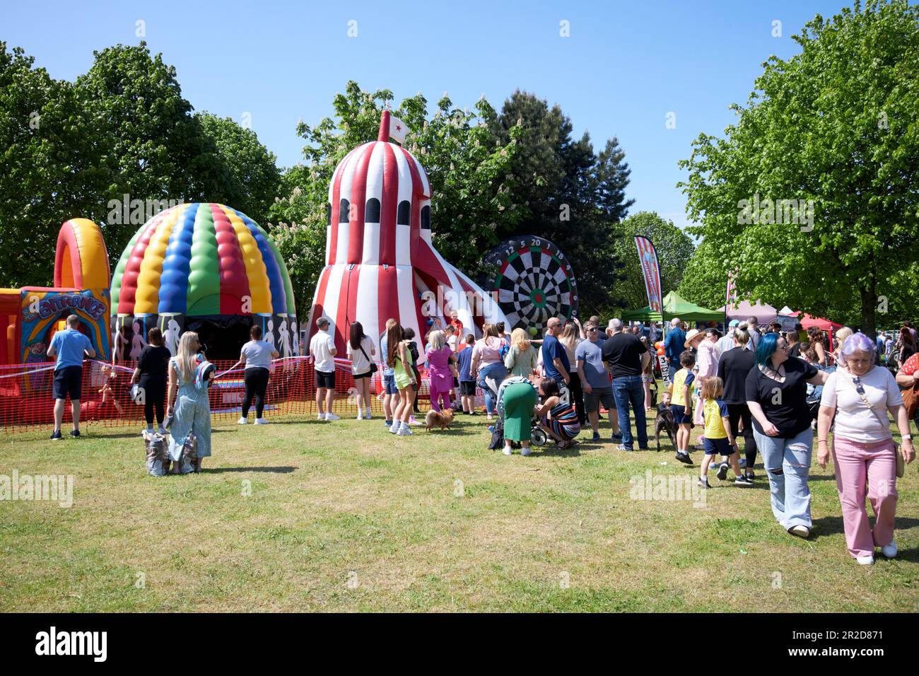 rides and inflatables at a local community summer fair simonswood ...