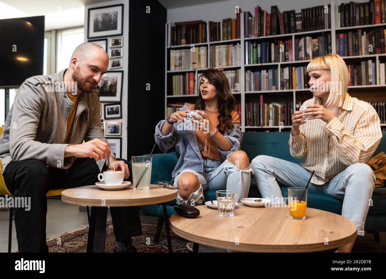 Three friends from college, owners of a small bookstore and library ...