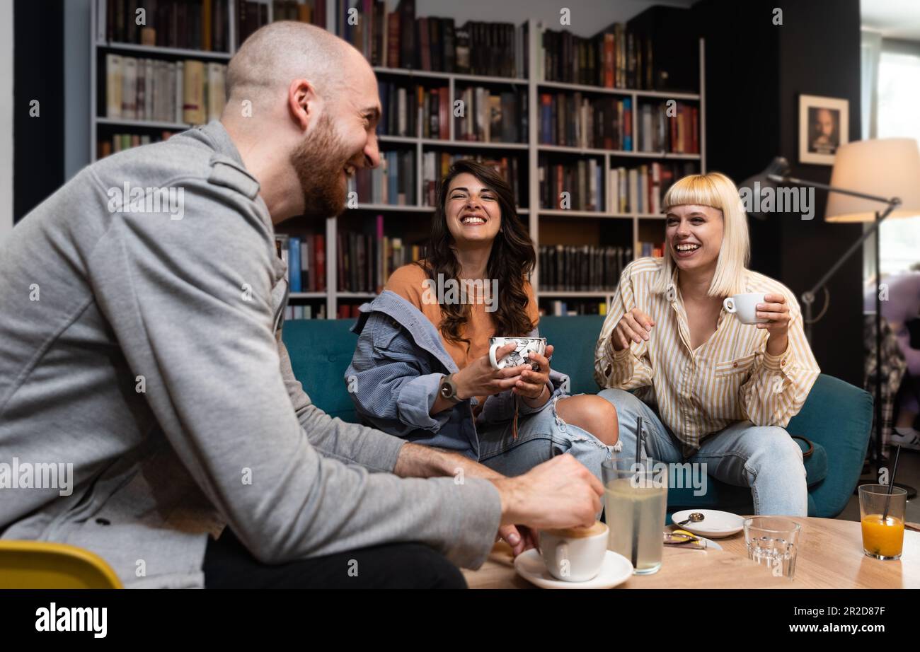 Three friends from college, owners of a small bookstore and library ...
