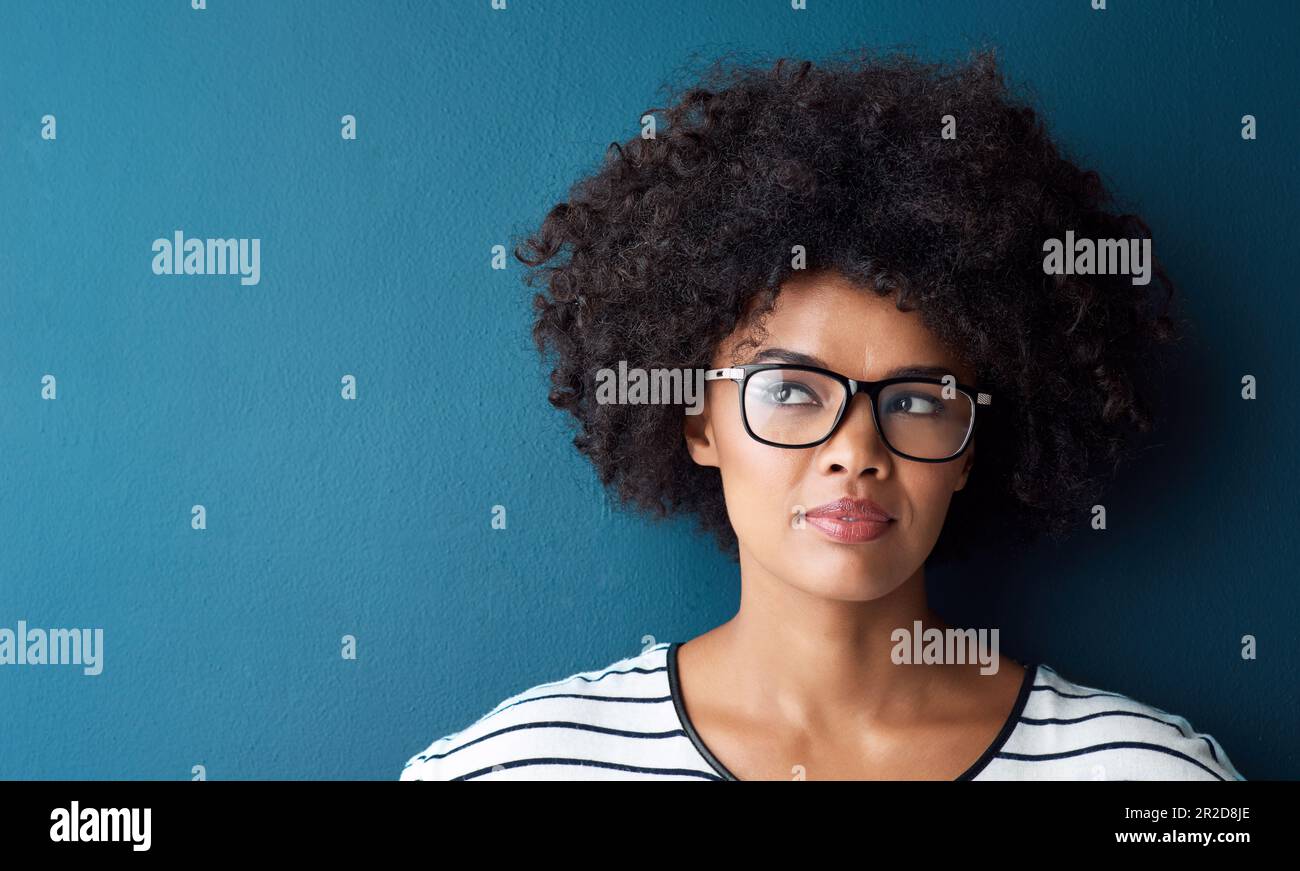 Optometry, thinking and woman with spectacles in a studio with ...